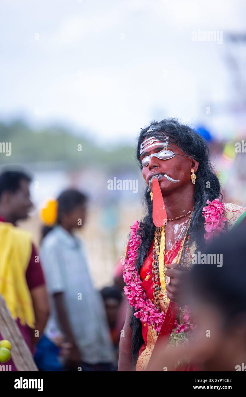 Kulasai, Portrait of indian hindu devotee with painted face and dressed ...
