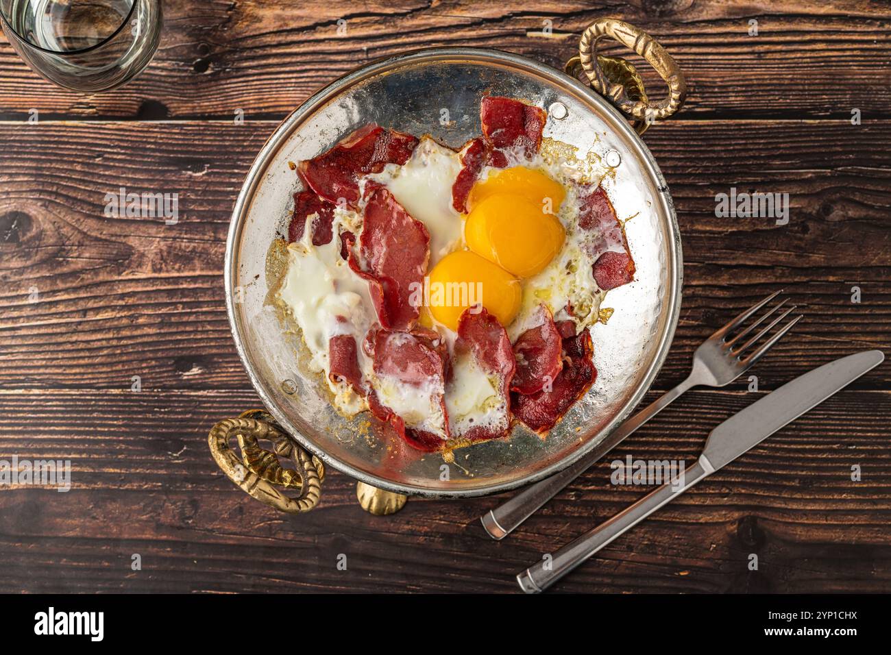 Traditional Turkish breakfast eggs with fried pastrami or bacon ...