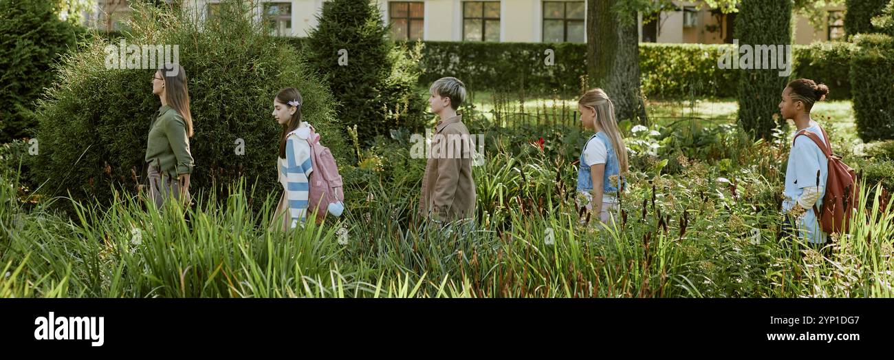 Teenagers Following Their Teacher During Outdoor Lesson Stock Photo - Alamy