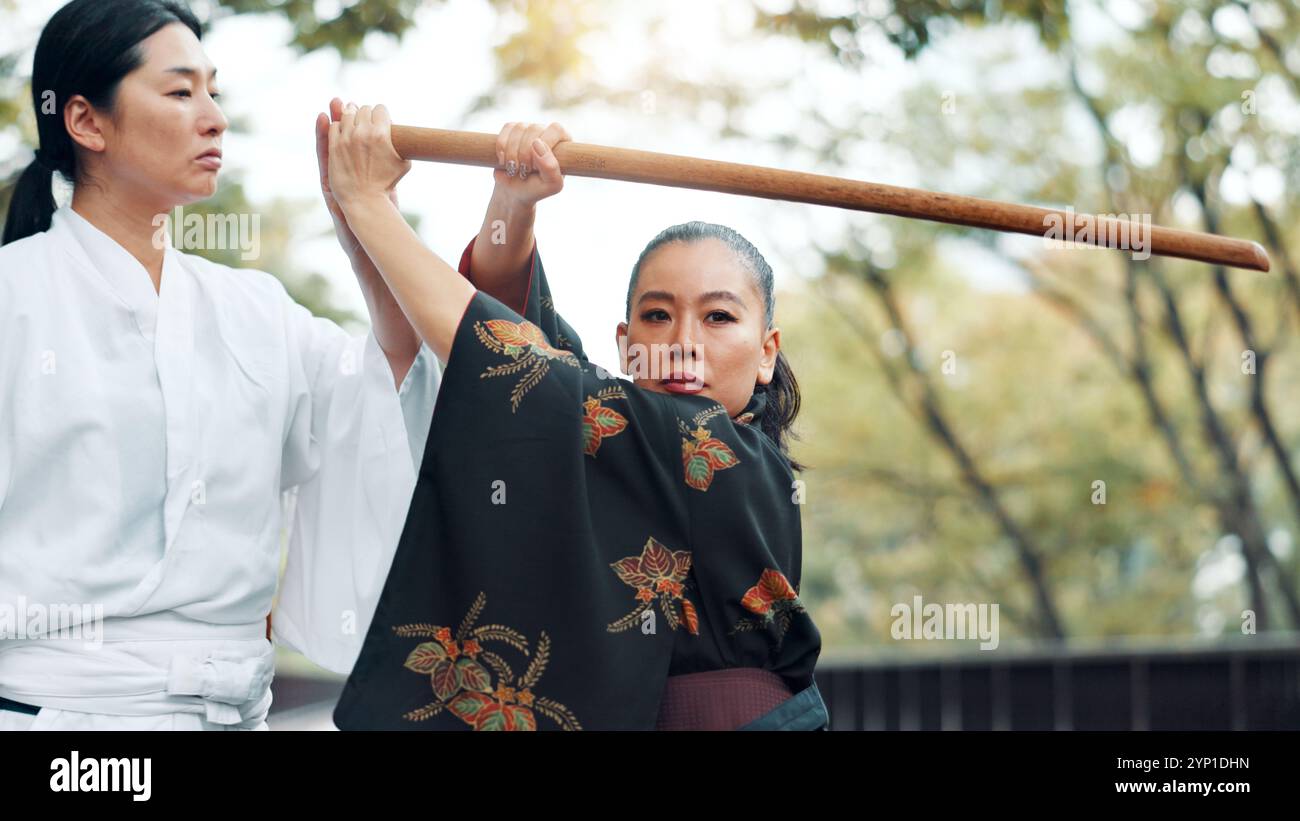 Instructor, bamboo sword and Asian woman for martial arts, Kendo ...