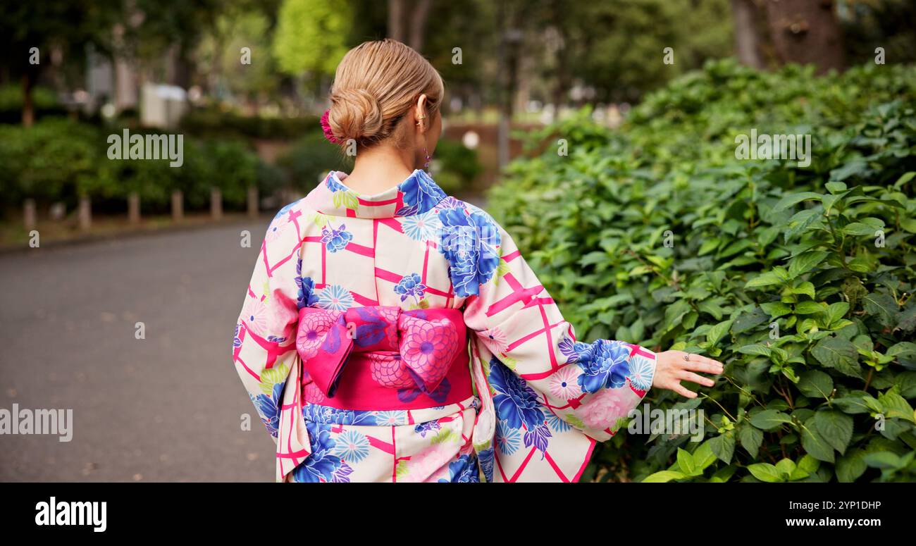 Back, woman and walking with kimono in park, Japanese culture and ...