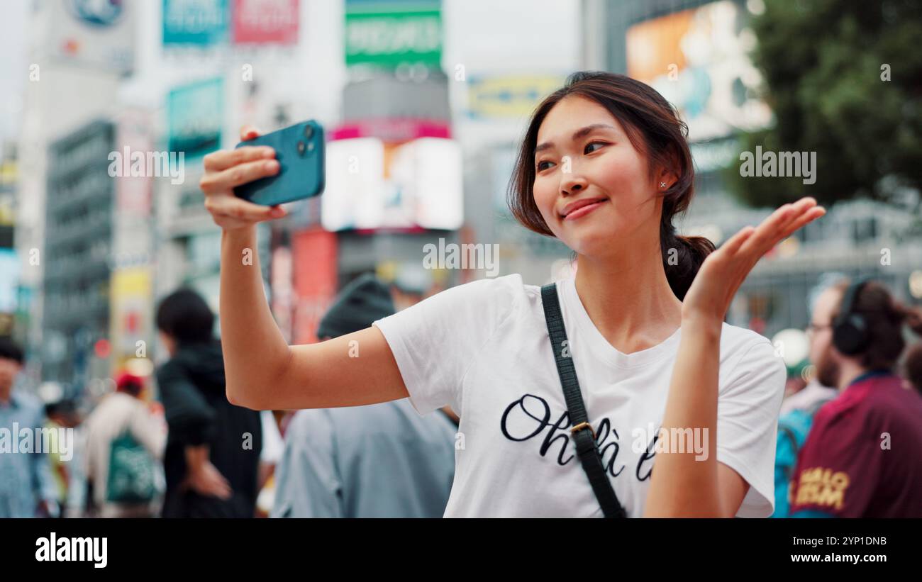 Japanese woman, selfie and happy in city with live streaming of vlogger ...