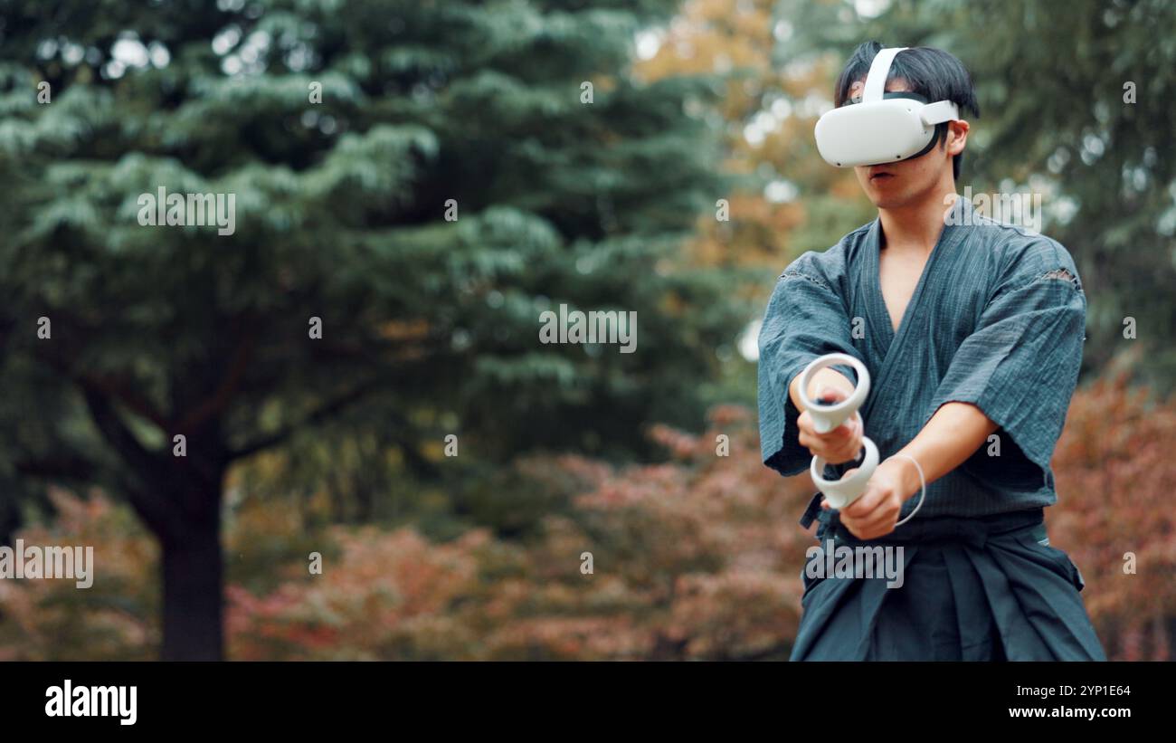 Virtual reality, controller and Asian man with technology for martial ...