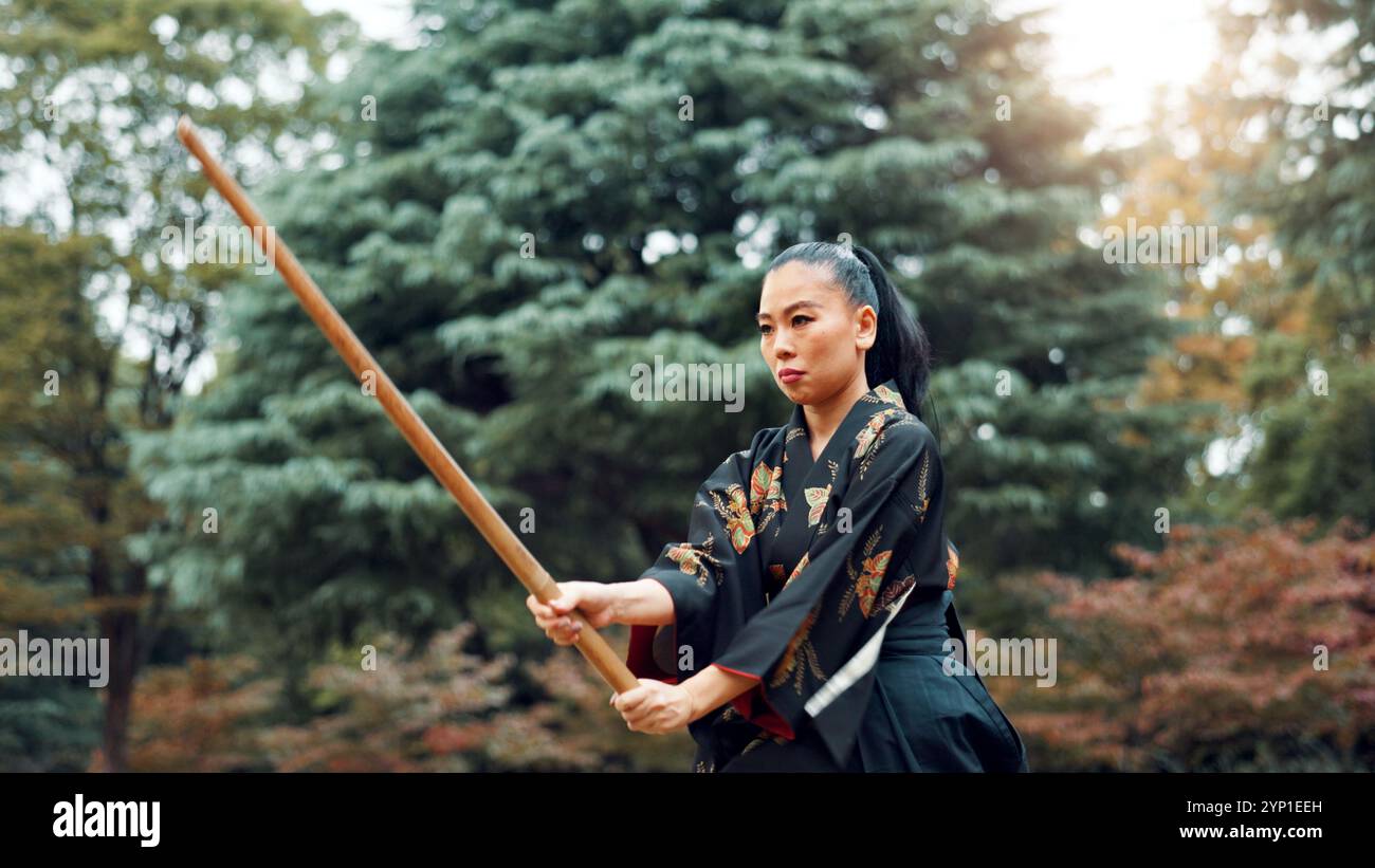 Park, training and Asian woman with bamboo sword in nature for martial ...