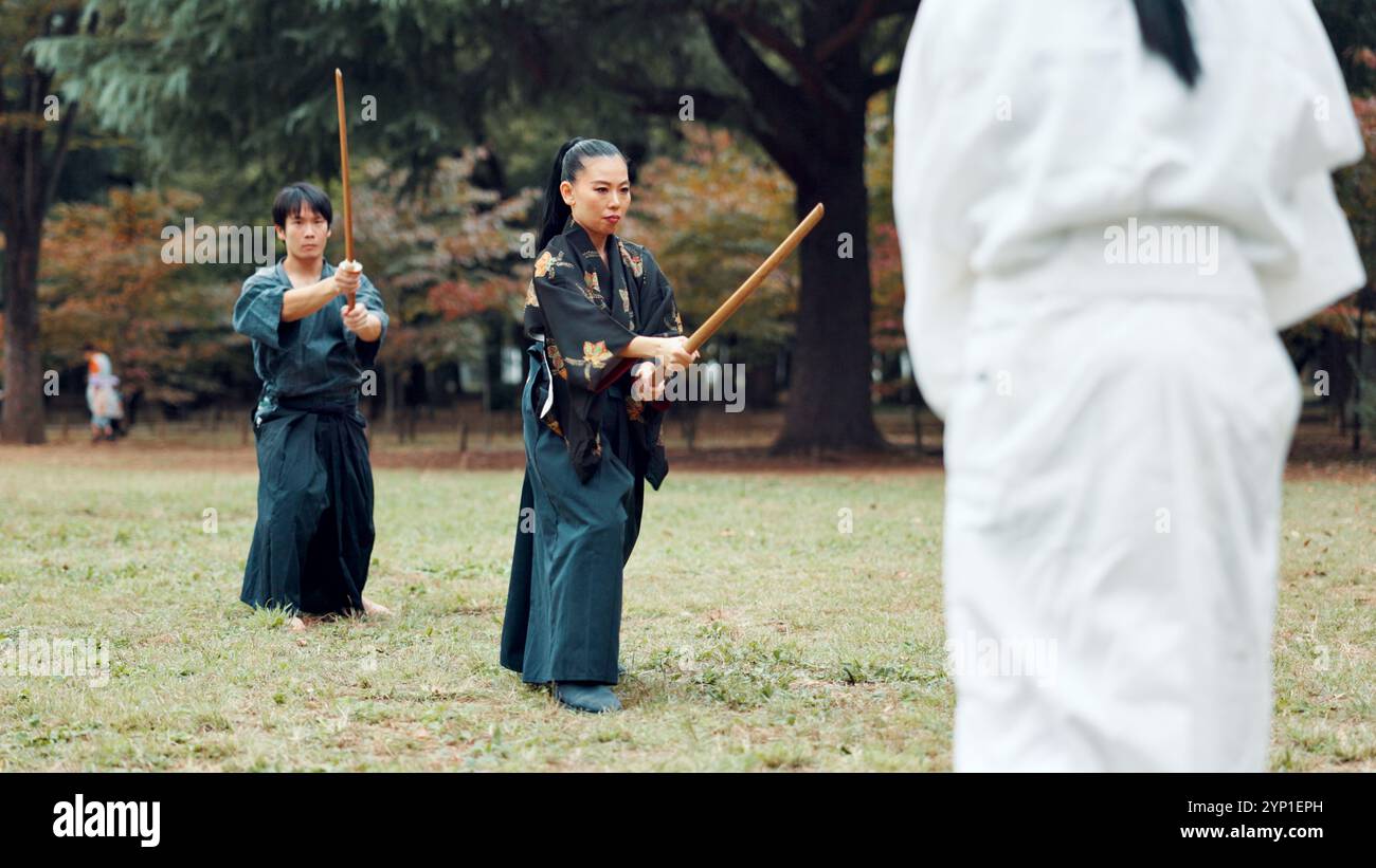 Martial arts, exercise and class instructor with wood sword for fight ...