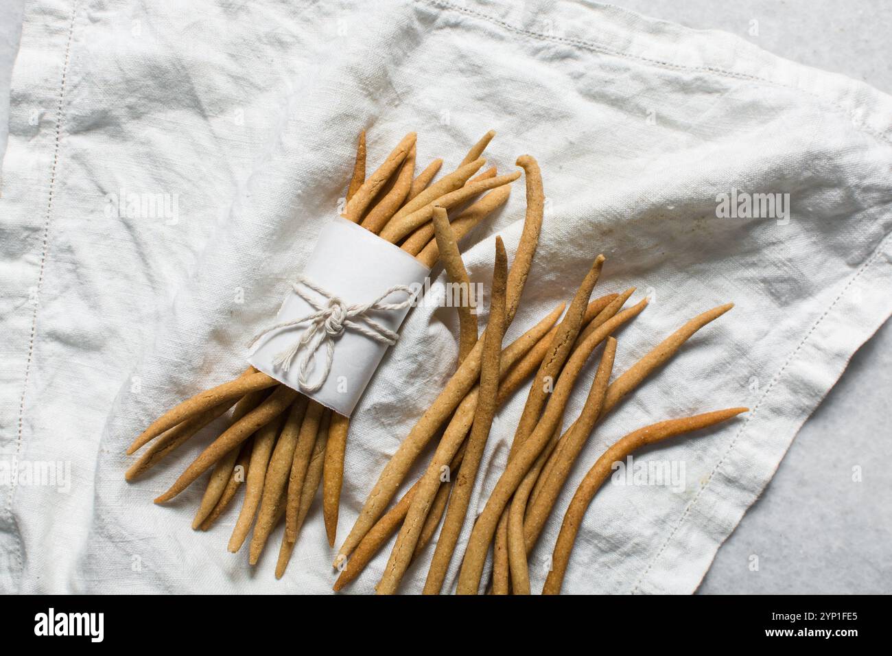 Top view of fried corn stick snack on a white granite countertop ...