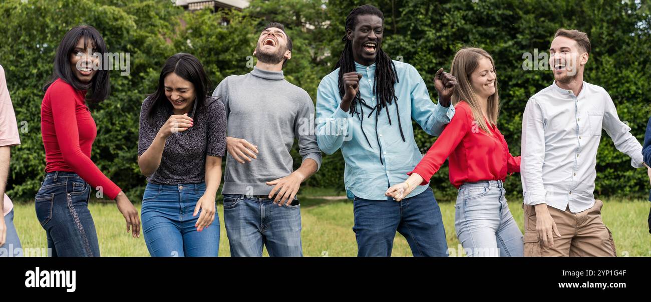 Natural moment of diverse young friends dancing and celebrating ...