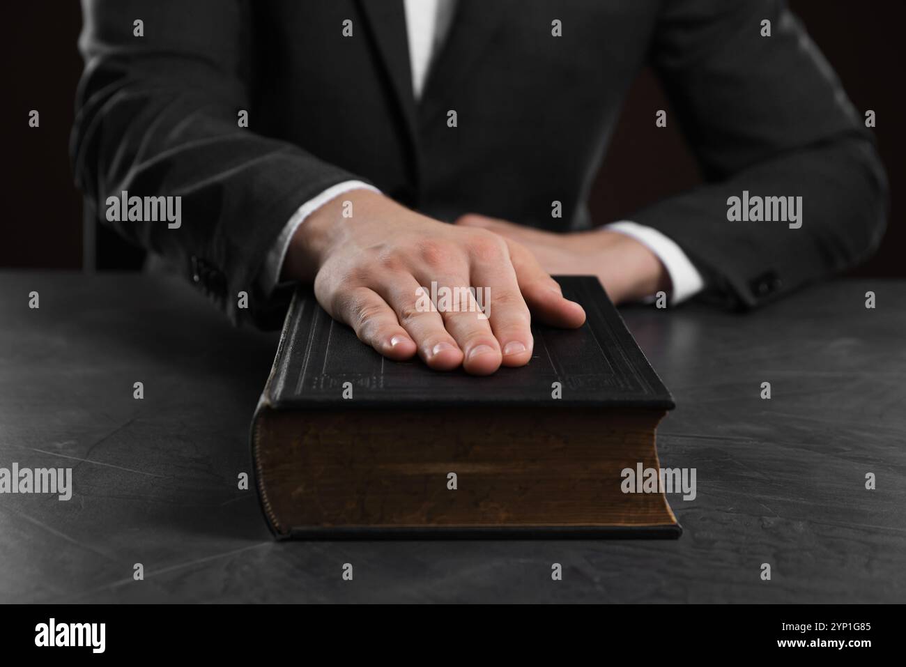 Oath black hand law hi-res stock photography and images - Alamy