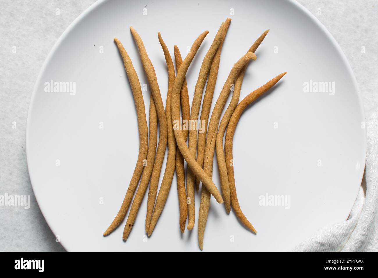 Top view of fried corn stick snack on a white plate, Overhead view of ...