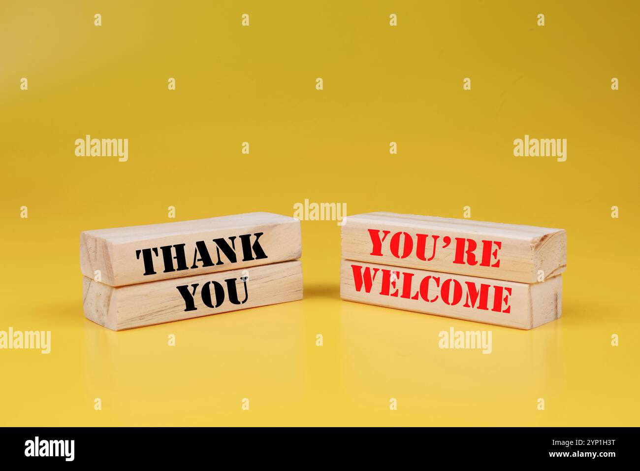 Thank you you're welcome symbol. Wooden blocks with words Thank you ...