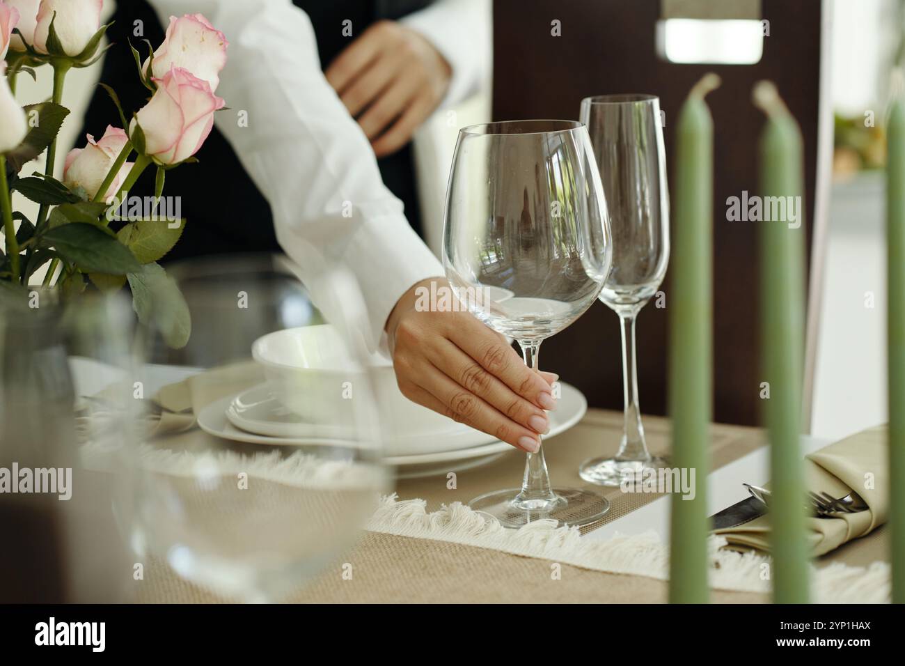 Setting Elegant Dinner Table With Wine Glasses Stock Photo - Alamy