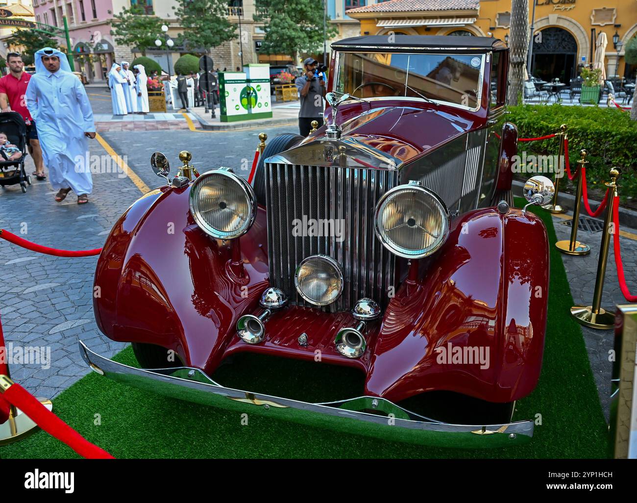 QATAR CLASSIC CARS EXHIBITION 2024 IN DOHA People look at Rolls Royce ...