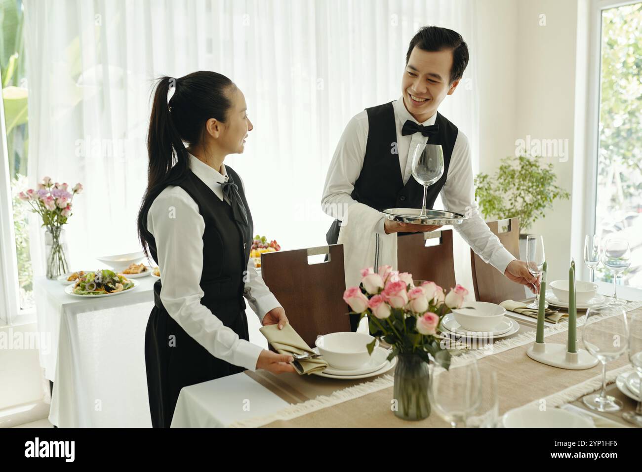 Setting Elegant Table for Formal Dining Event Stock Photo - Alamy