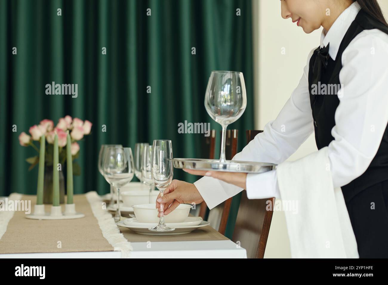Setting Up Elegant Dining Table for Formal Event Stock Photo - Alamy