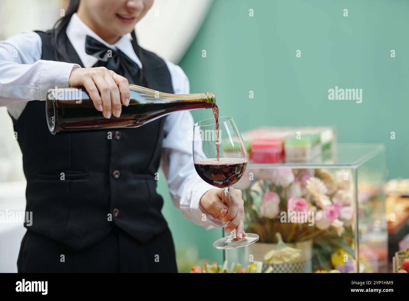 Sommelier Pouring Wine at Elegant Event Stock Photo - Alamy