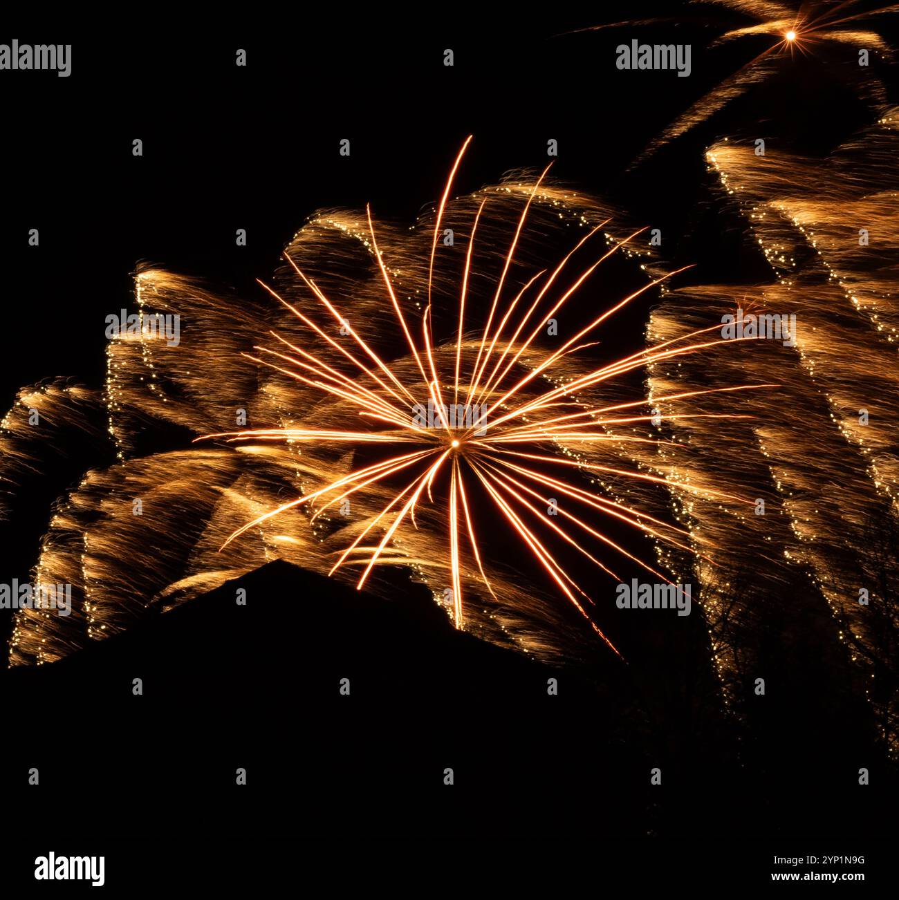 Explosion of fireworks in the night sky on bonfire night in November ...