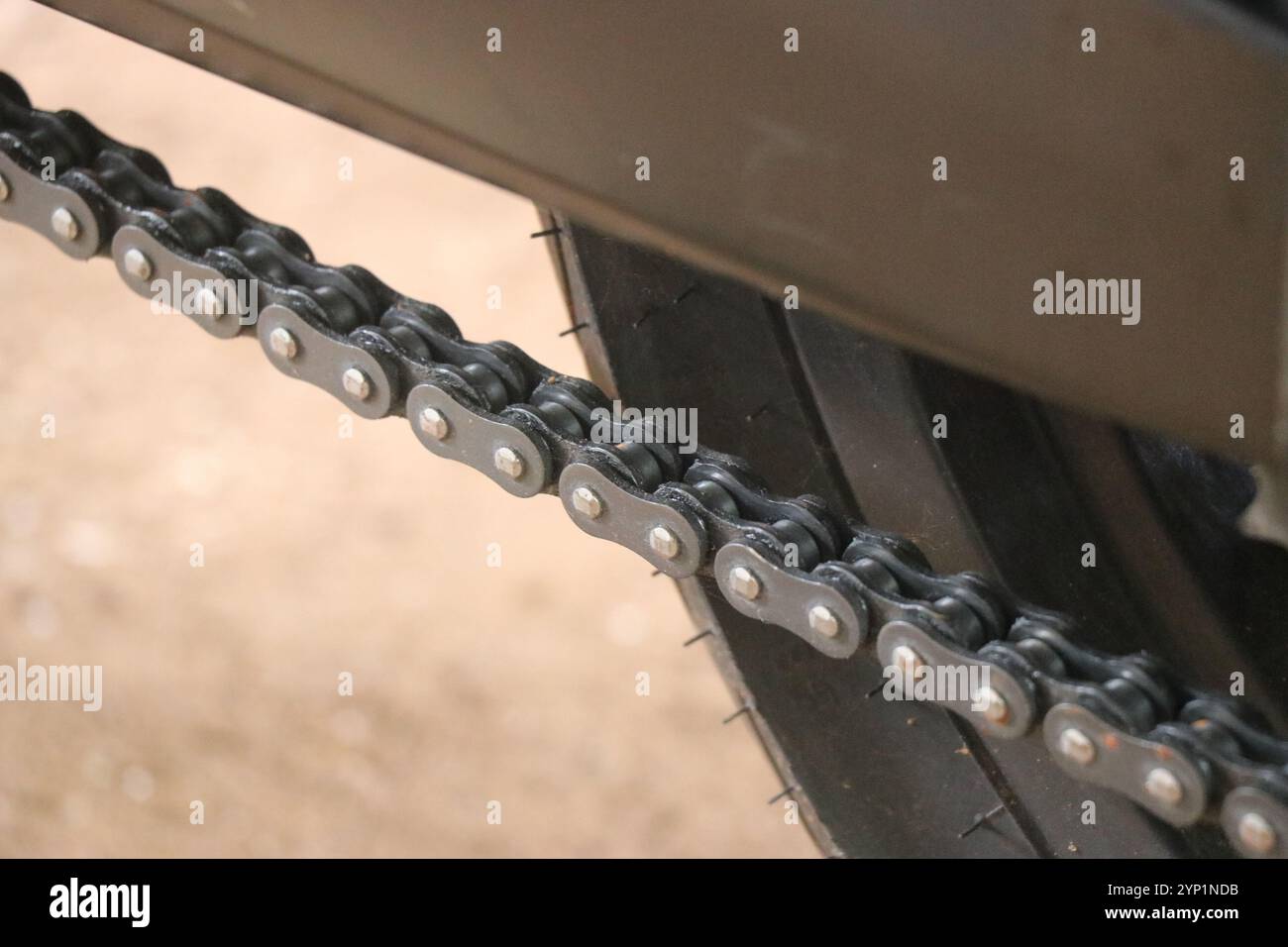 View of a chain from motorcycle. Chains that drive the wheels are ...