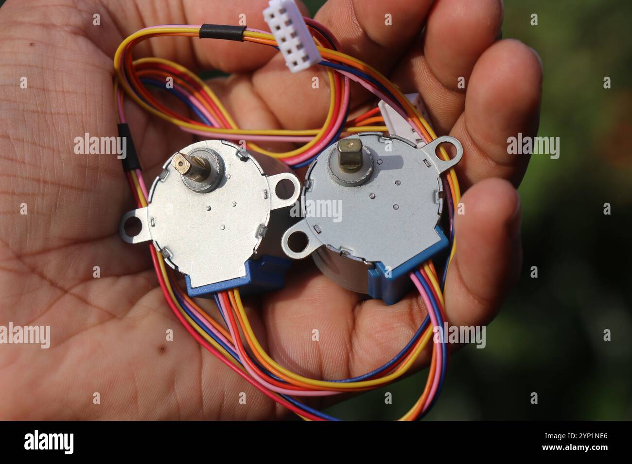 Stepper motor used in making robots and in other electronics held in ...