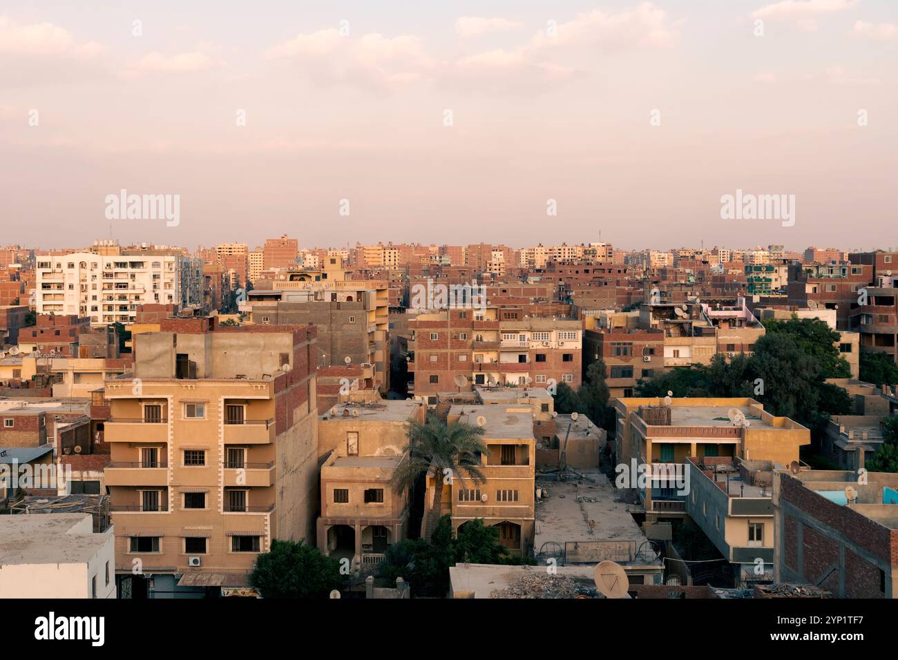 Aerial view of Cairo of red brick houses from the Giza pyramid complex ...