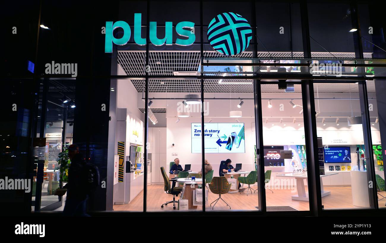 Warsaw, Poland. 22 November 2024. Storefront and sign of a store of Plus selling phones and ...
