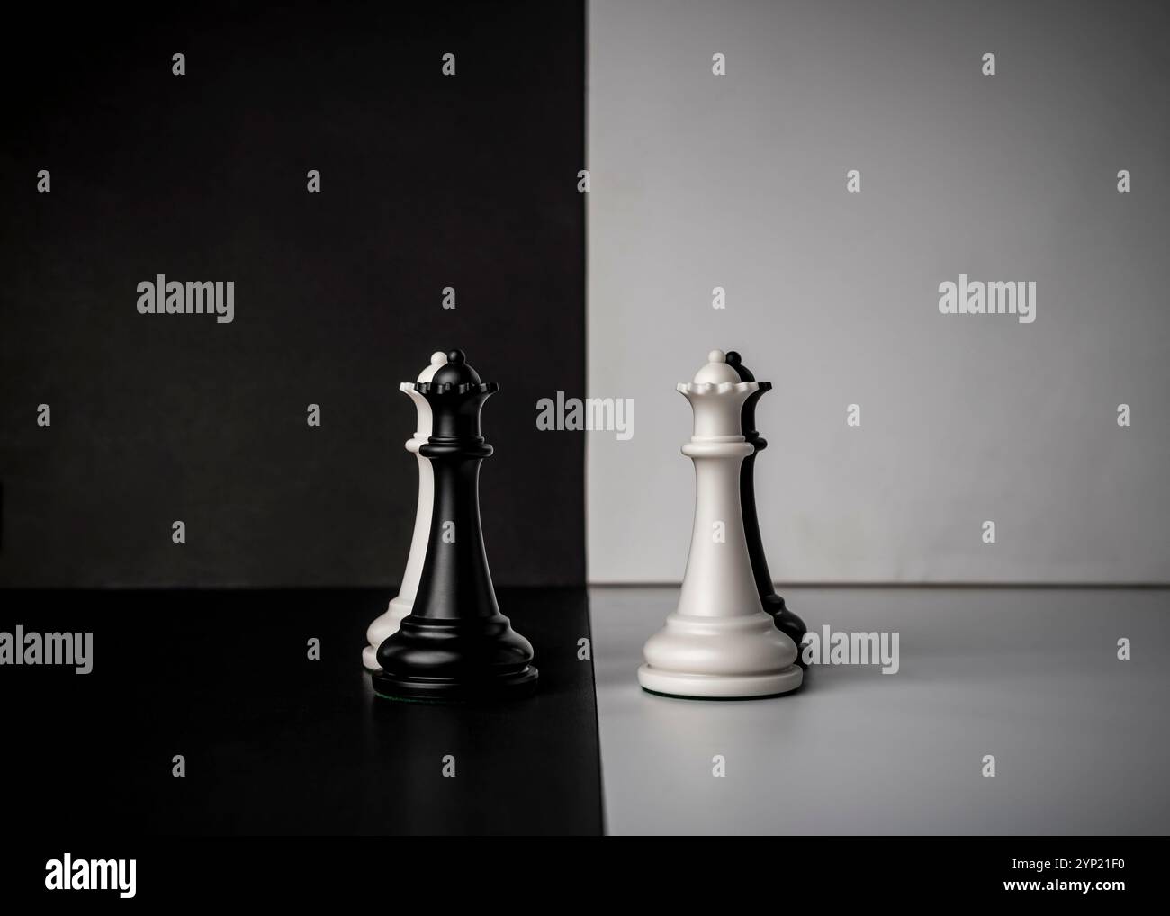 Conceptual Composition With Chess Pieces In Dramatic Light Duality