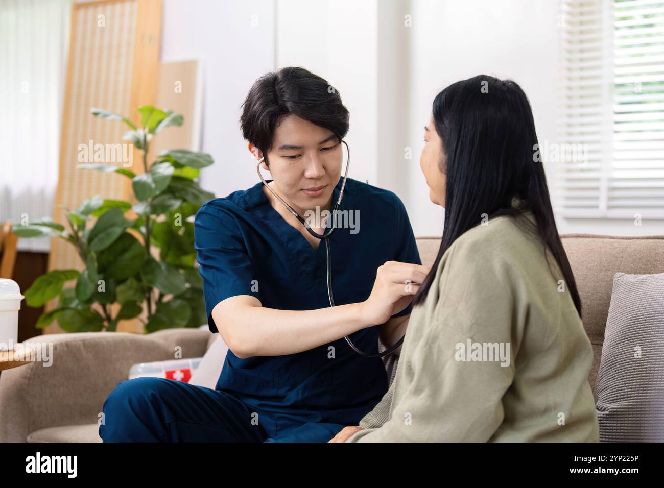 Healthcare Professional Conducting a Routine Check-Up with Patient in a ...