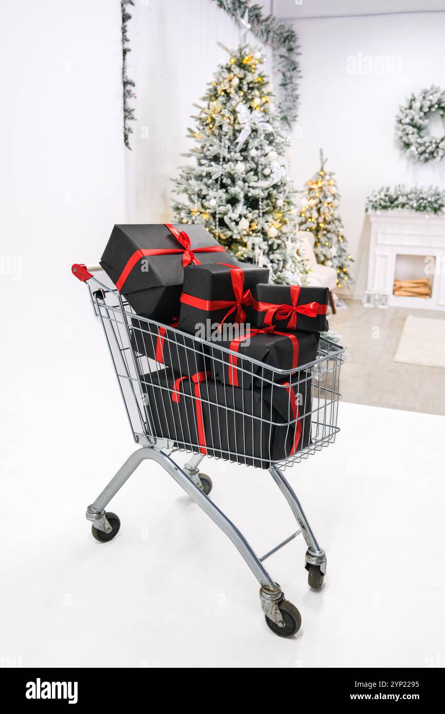 Shopping cart with present box Stock Photo - Alamy