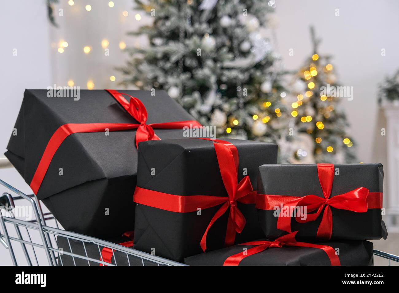Shopping cart with present box Stock Photo - Alamy