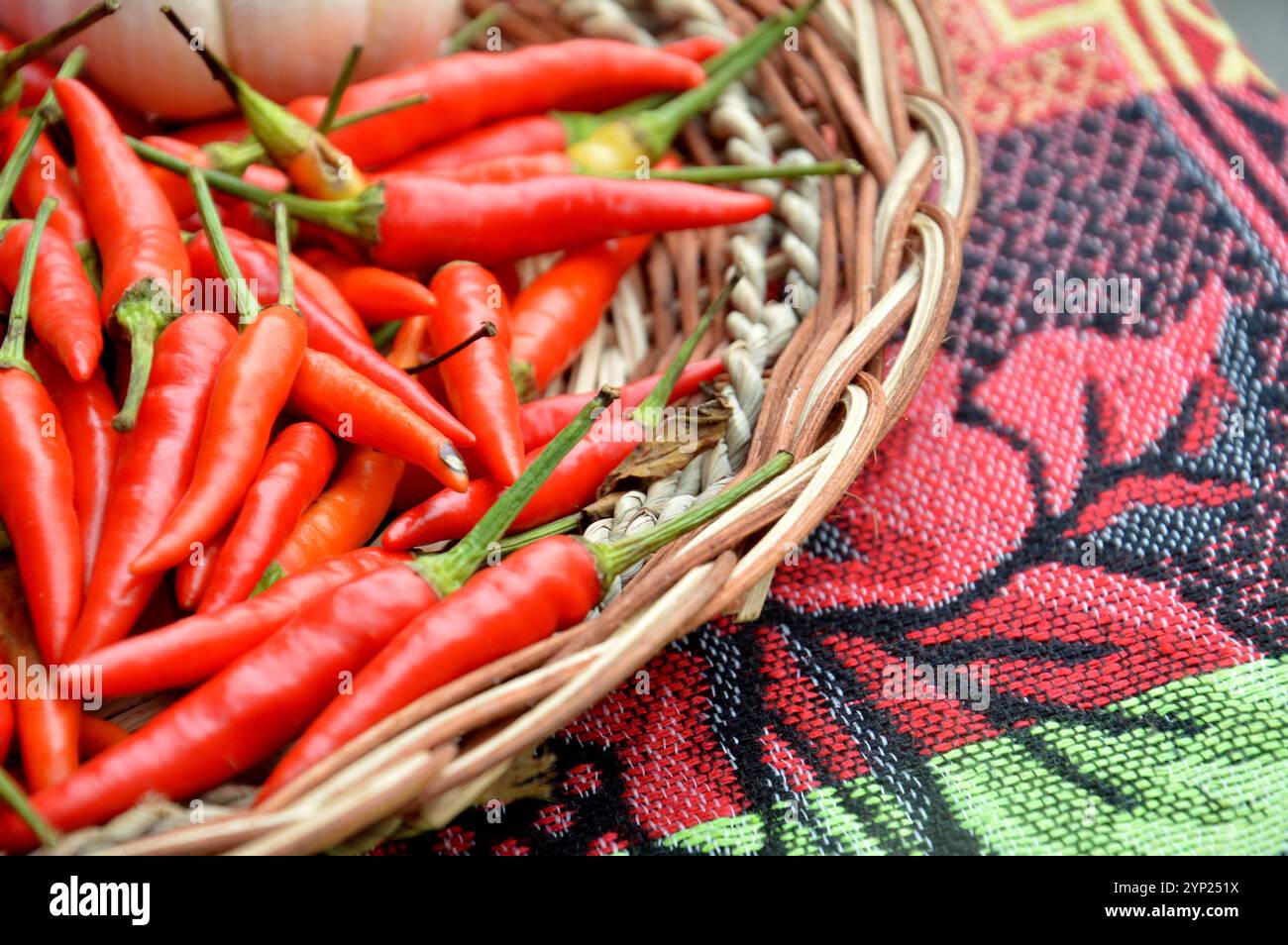little chili red in a wicker plate Stock Photo - Alamy