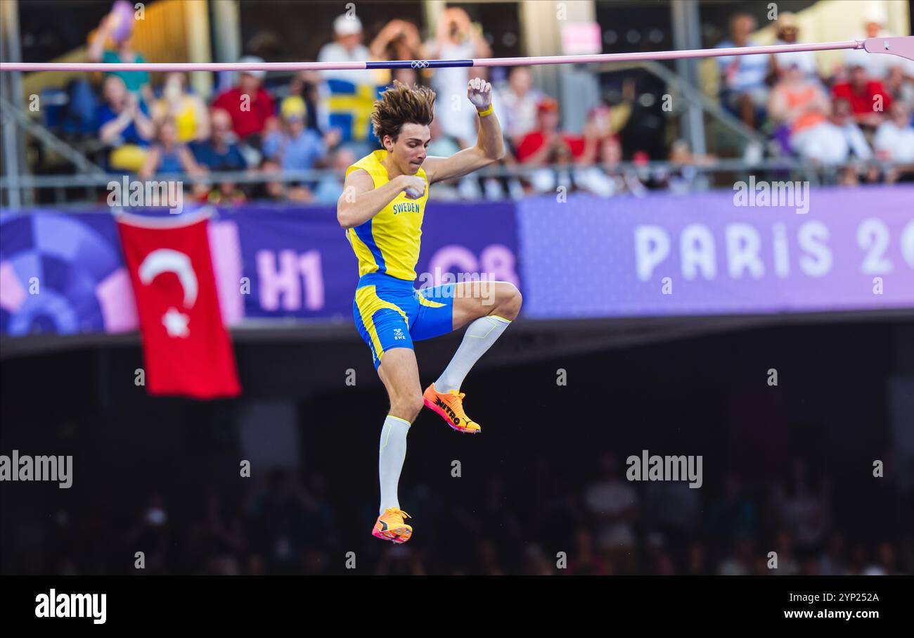 Mondo Duplantis participating in the pole vault at the Paris 2024 ...