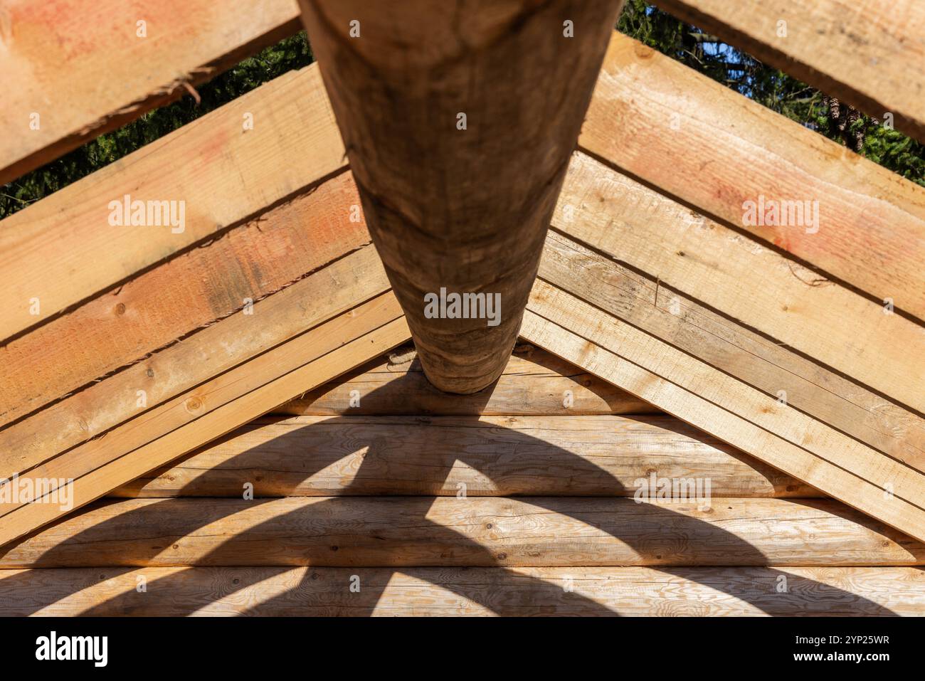 Wooden house is under construction. Background photo with roof details ...