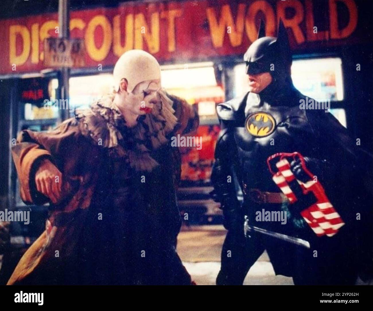 BATMAN RETURNS 1992 Warner Bros. film with Michael Keaton at right as ...