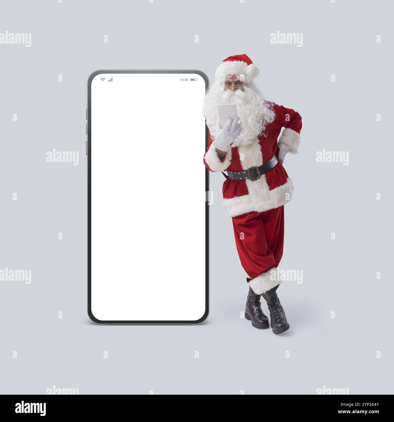 Santa Claus leaning on a big smartphone with blank screen Stock Photo ...
