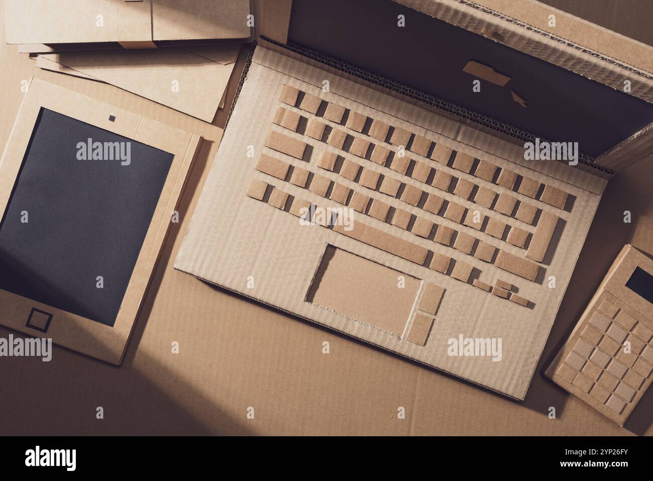 Business desktop with laptop and other objects made of cardboard ...