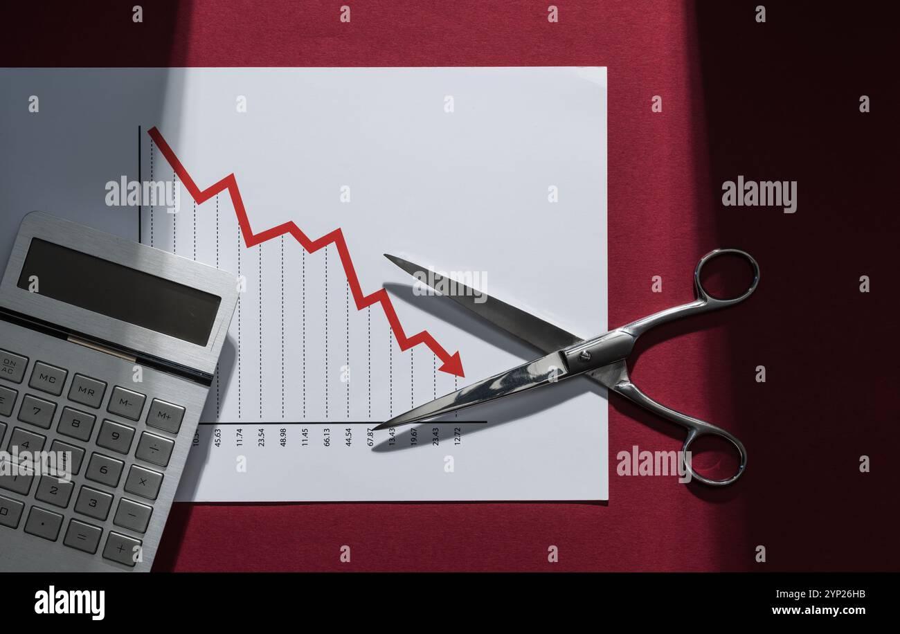Financial chart showing negative trend and scissors: financial crisis ...