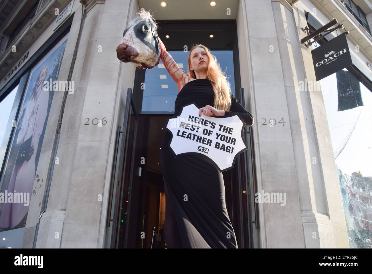 London, UK. 28th November 2024. A PETA activist stands outside the ...