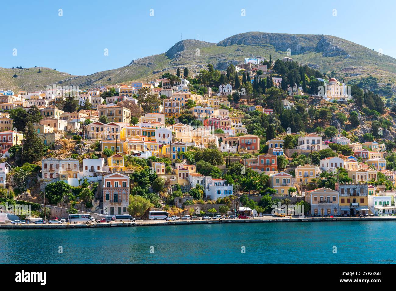 Pastel colored houses on Symi island. Dodecanese, Greece Stock Photo ...