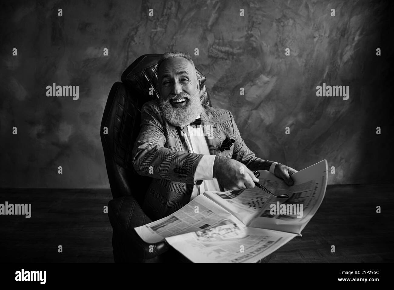 Attractive, laughing boss in suit, tux with bow indicate, pointing with ...