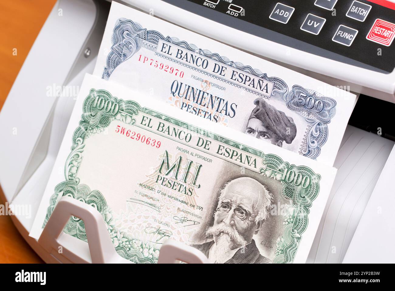 Old Spanish money - peseta in the counting machine Stock Photo - Alamy