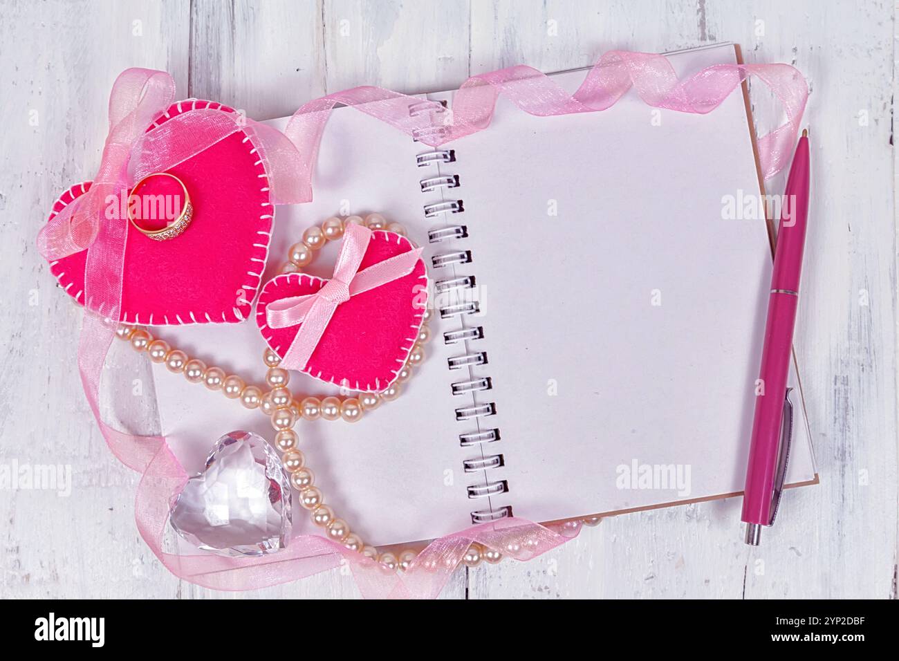 Valentines day toy hearts and notepad for your text. Top view on wooden ...