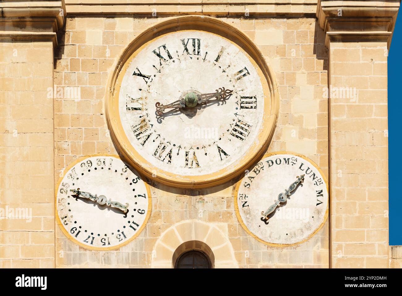 Antique dilapidated clock and calendar on the facade of St. John's Co-Cathedral in Valletta ...