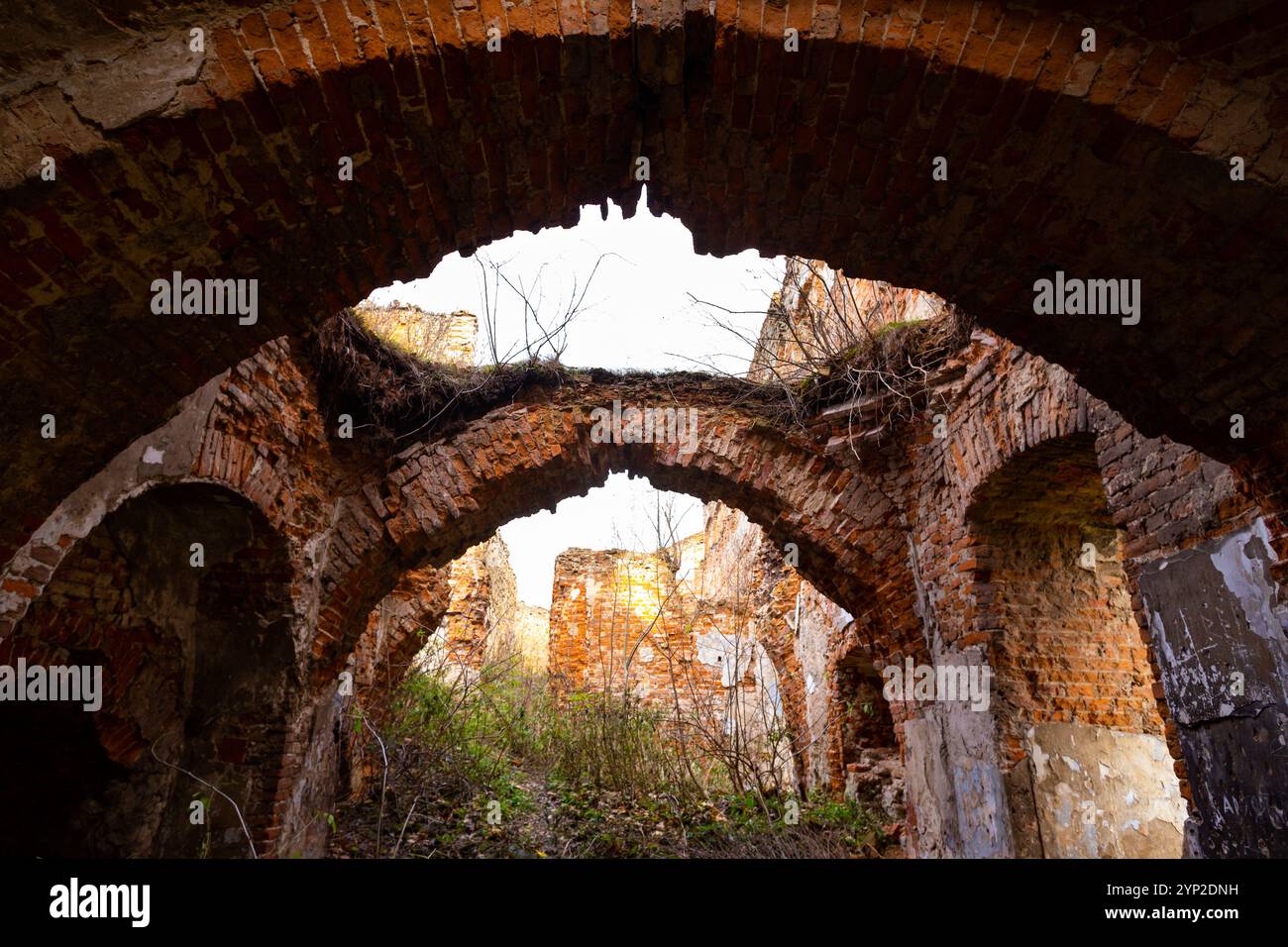 The old ruins of the collapsed walls with gates and windows ...