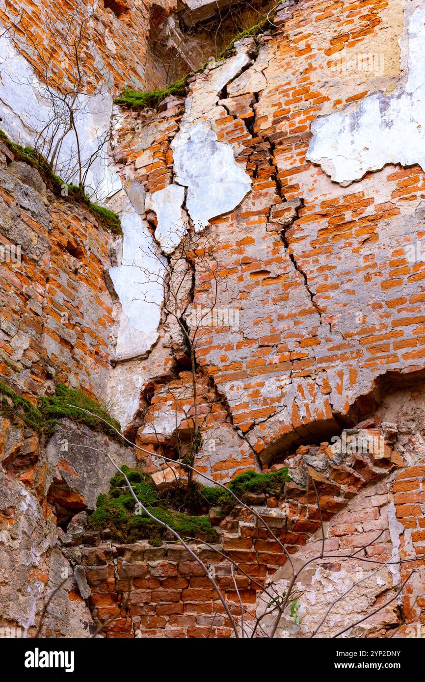 The old ruins of the collapsed walls with gates and windows ...