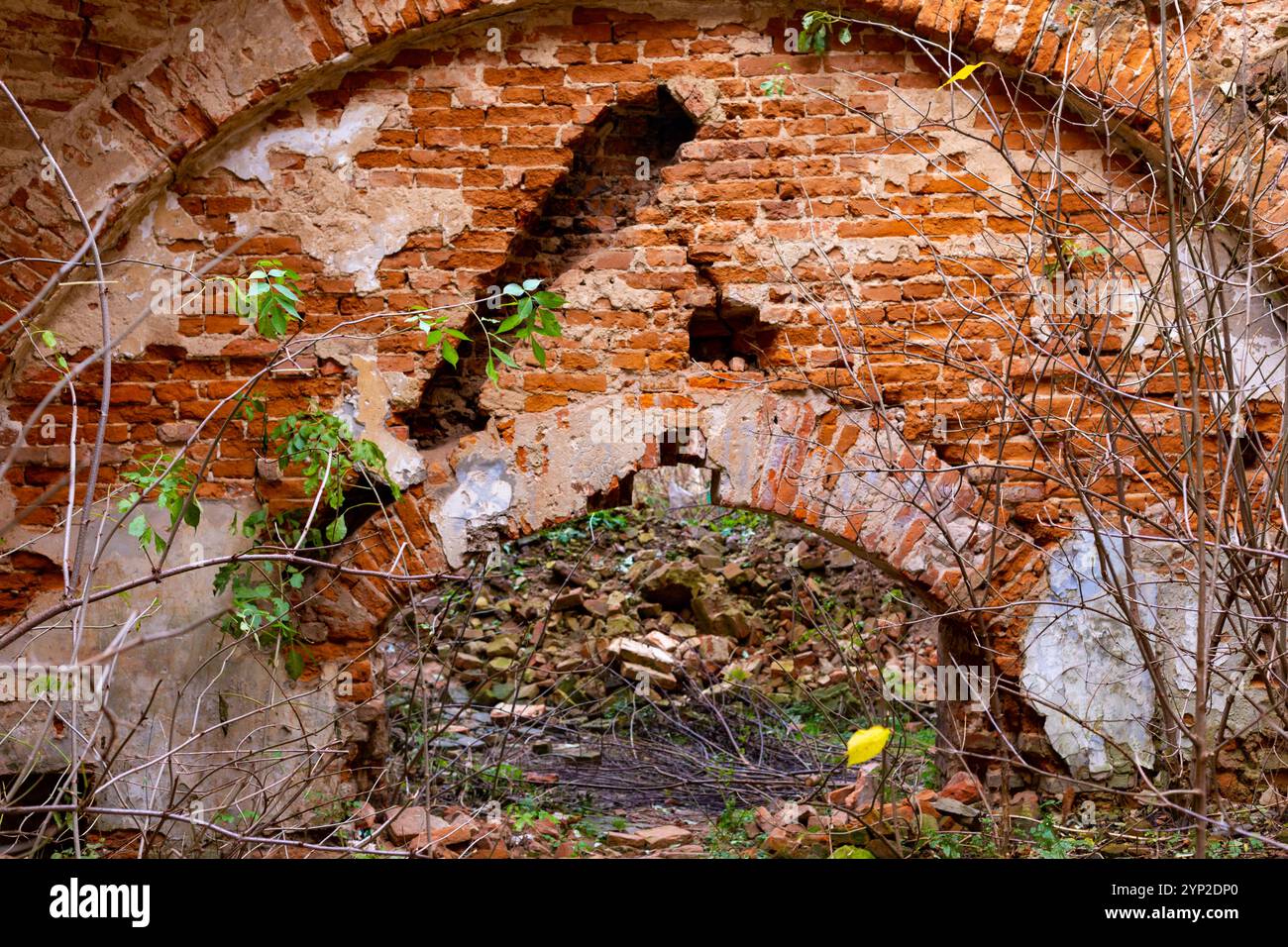 The old ruins of the collapsed walls with gates and windows ...