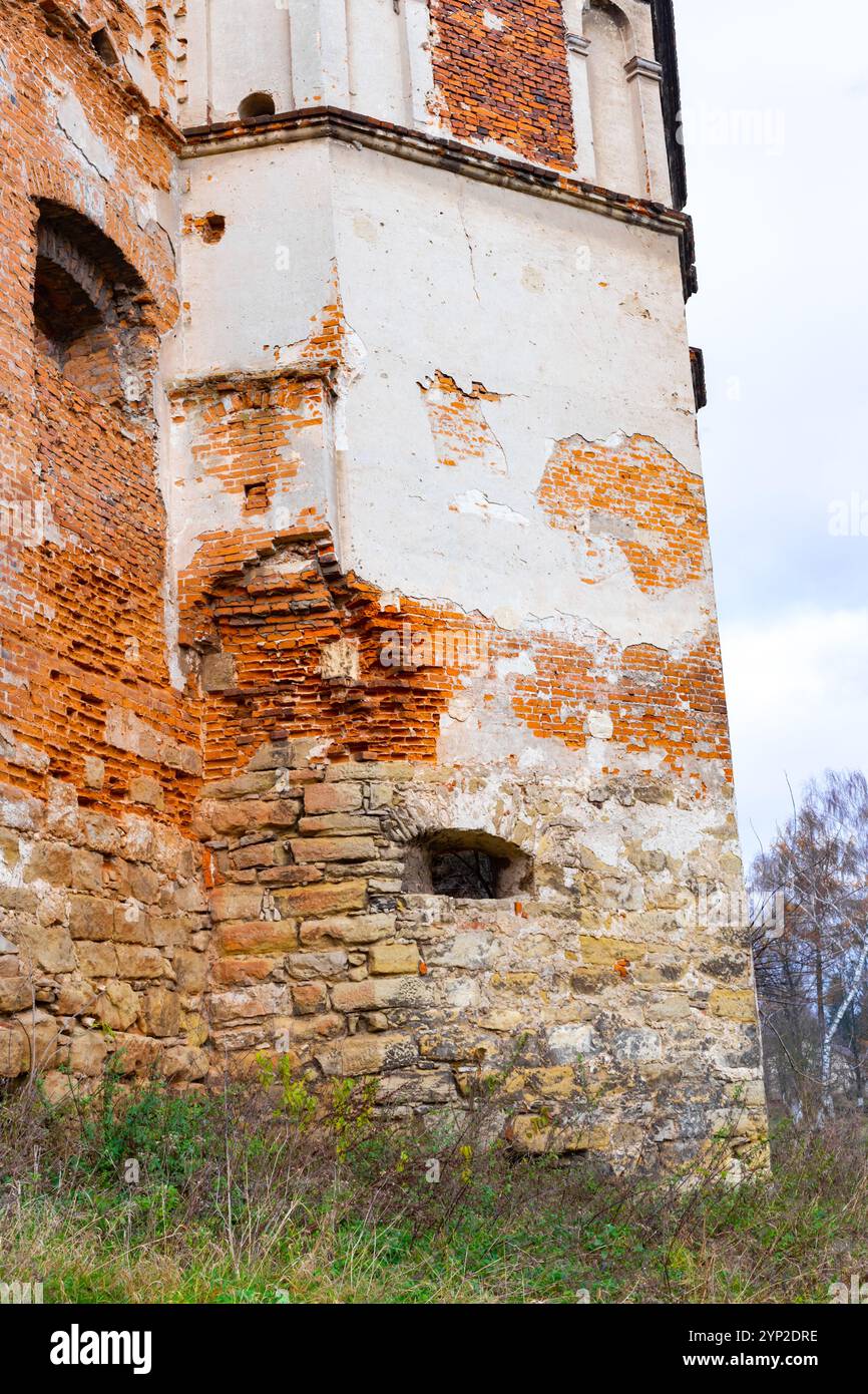 The old ruins of the collapsed walls with gates and windows ...