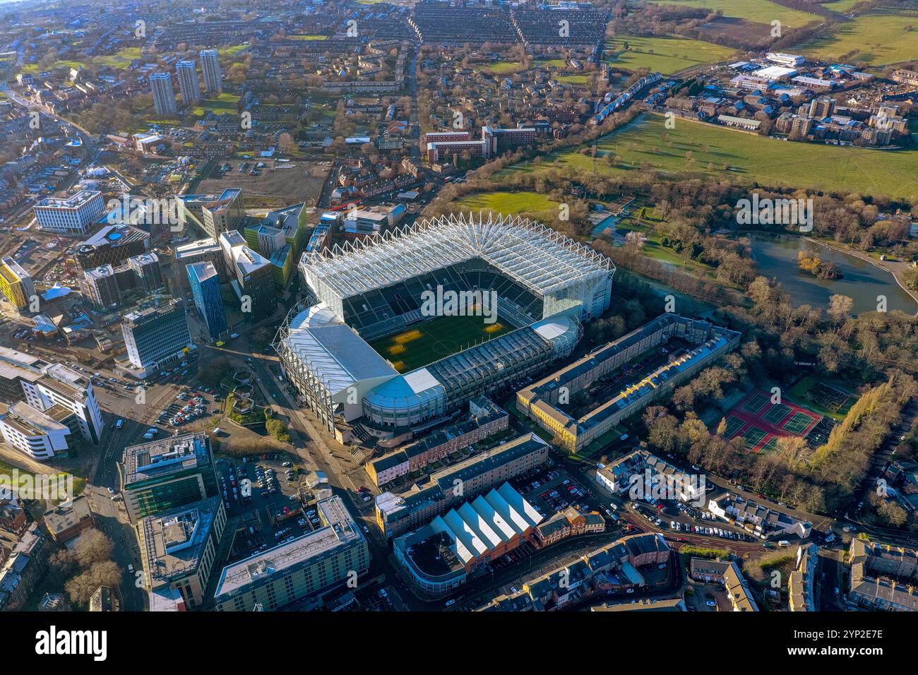 A breathtaking aerial view of St. James' Park stadium in Newcastle, surrounded by lush greenery ...