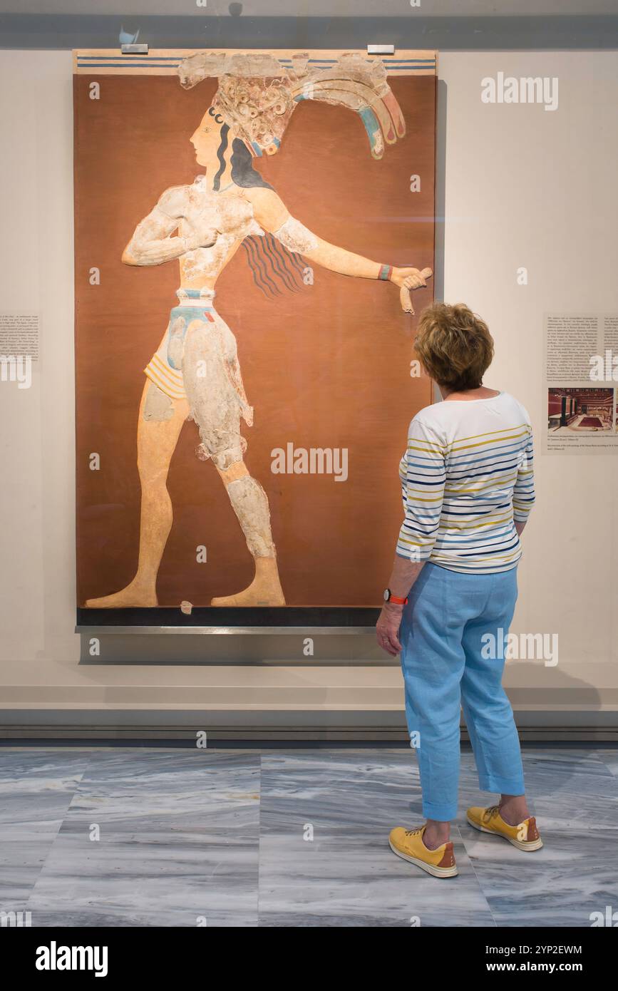 Heraklion museum, rear view of a tourist studying the ancient Minoan ...