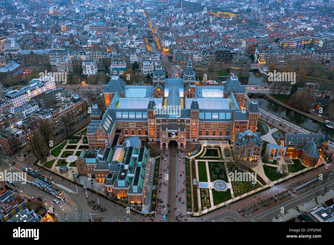 Aerial view of the iconic Rijksmuseum in Amsterdam during dusk, showcasing its grand ...