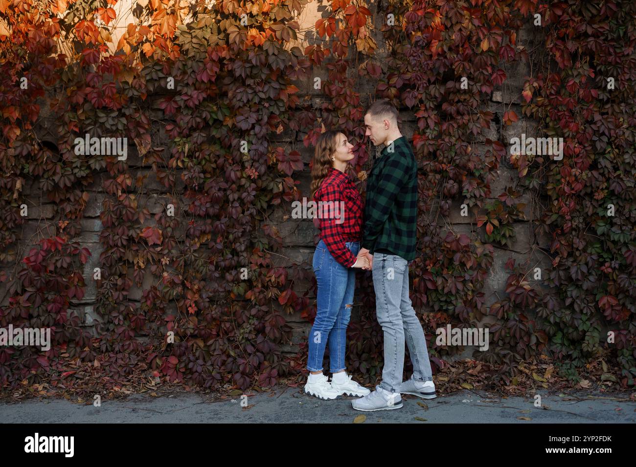 Adorable Couple Sharing a Tender Moment Against a Fall Foliage ...