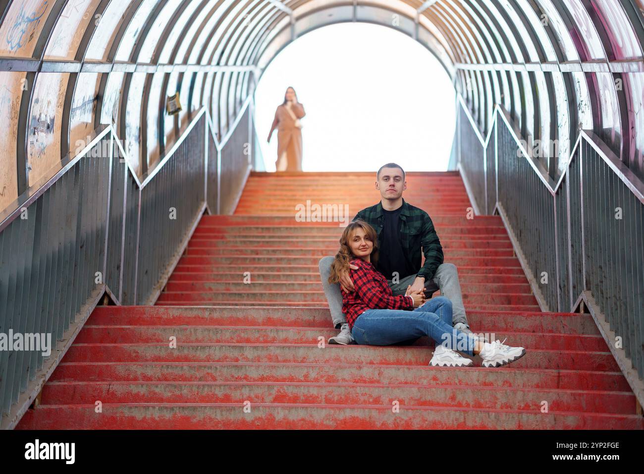 Romantic Couple Sitting on Steps in a Urban Setting Stock Photo - Alamy